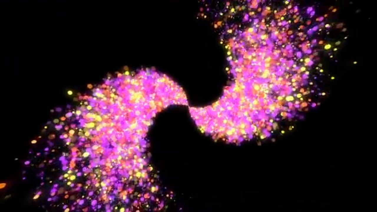 A vortex of purple and yellow particles swirls in a mesmerizing display ...